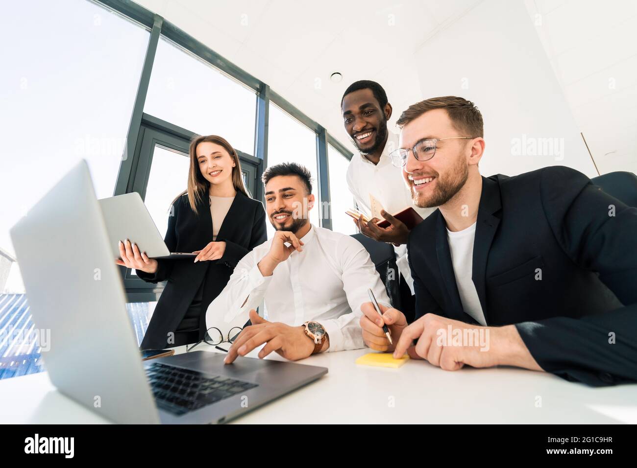 Company employees gathered for morning briefing in the boss's office ...