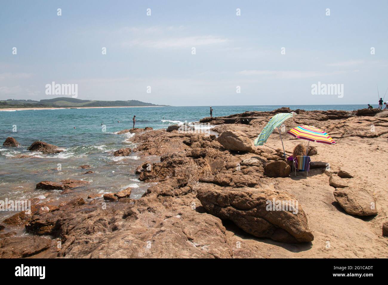 Holiday makers enjoying the sum off the rocks, south africa Stock Photo ...