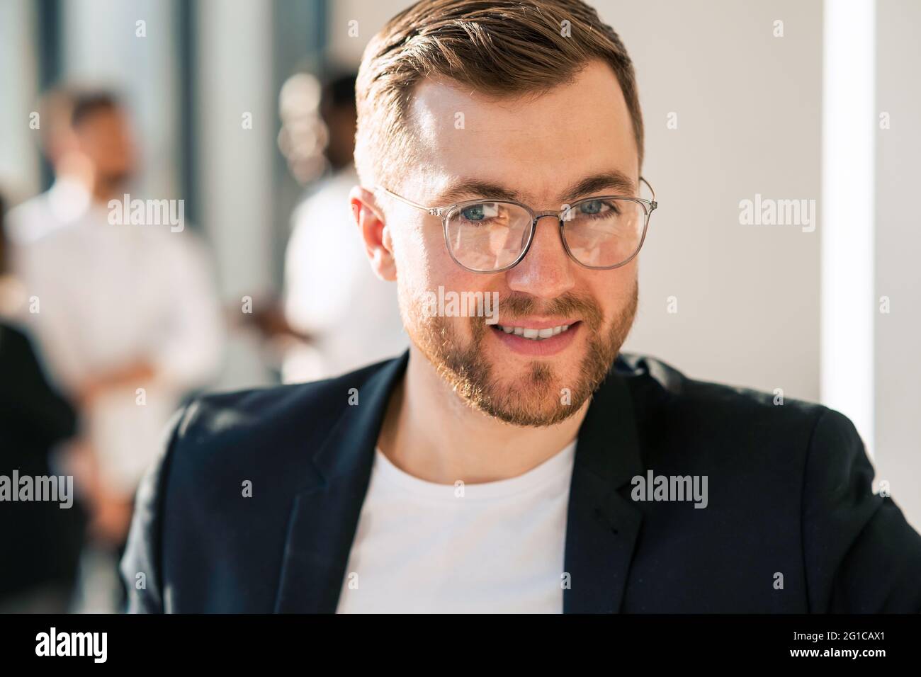 Close-up portrait of handsome office employee Stock Photo - Alamy