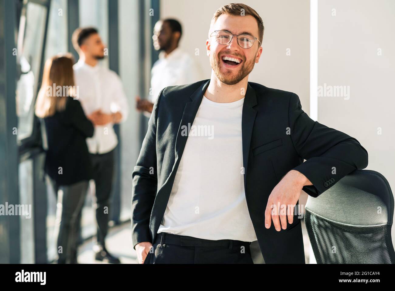 Portrait of laughing business man Stock Photo - Alamy