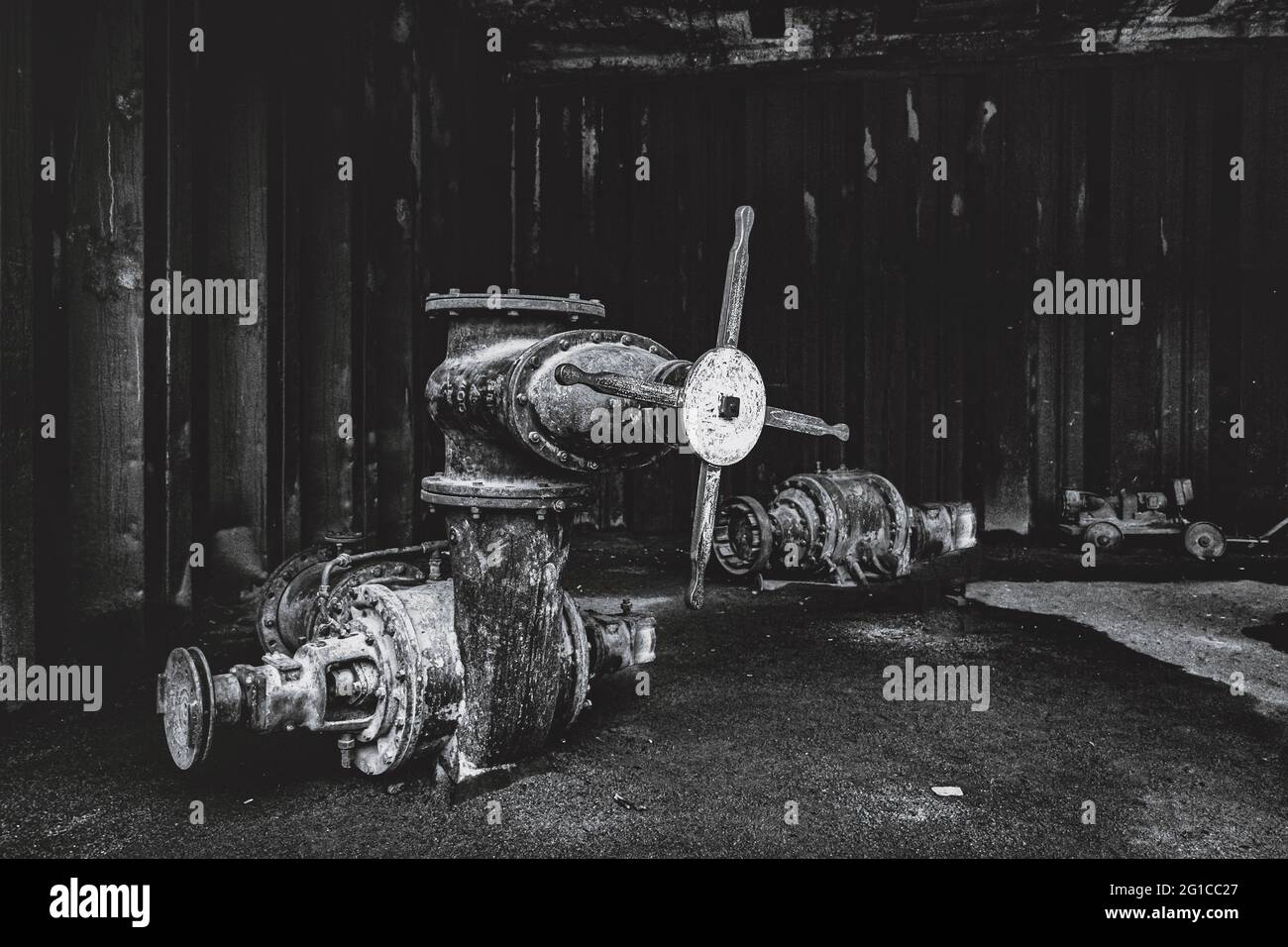 Abandoned hall of rusted metal and steel with obsolete components in ...