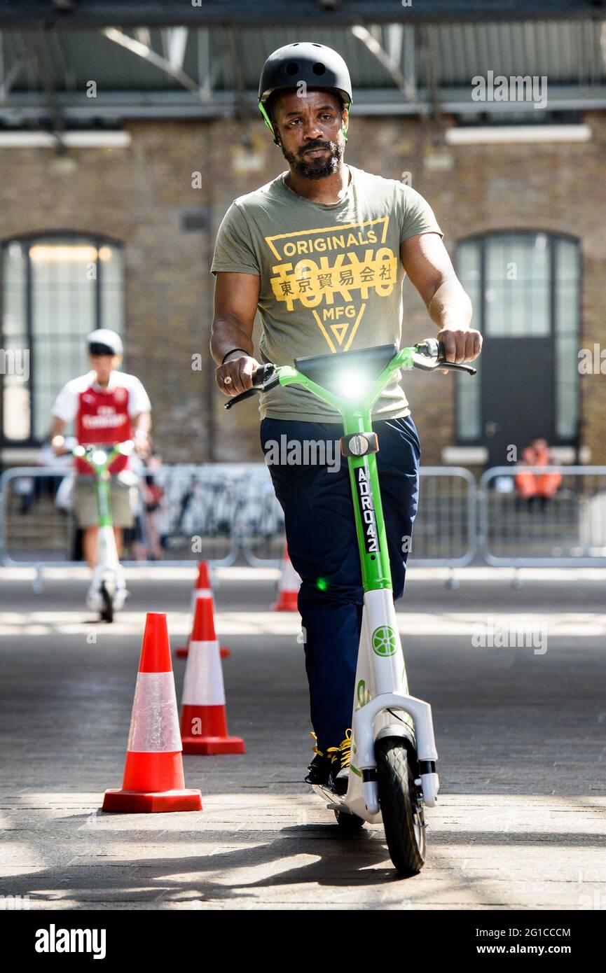 EDITORIAL USE ONLY Sean Martin rides an electric scooter as Lime announces a year-long trial in ...