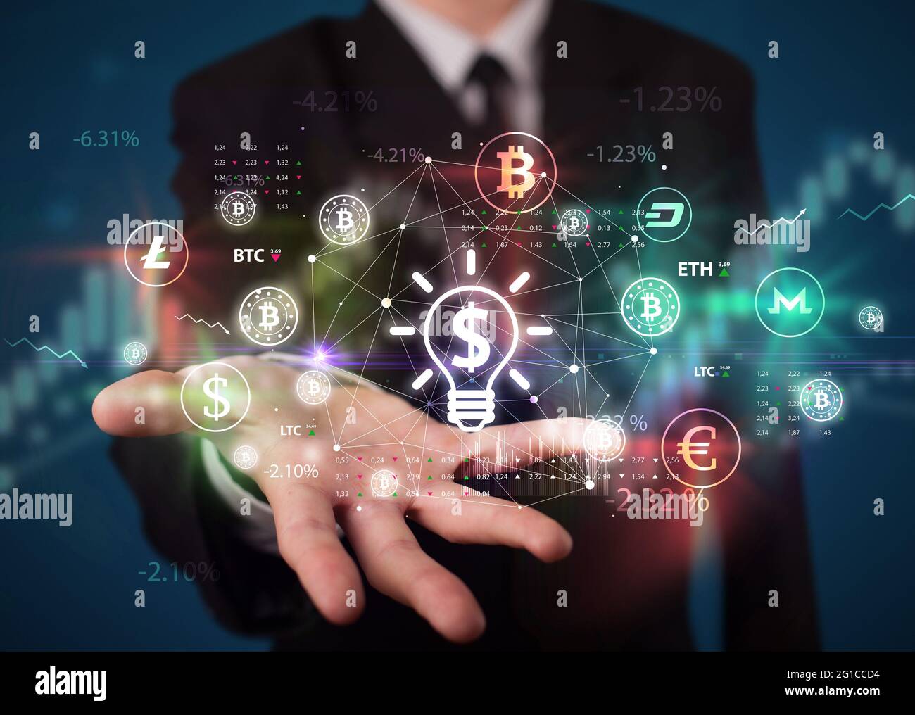 Businessman holding currency symbols concept Stock Photo - Alamy