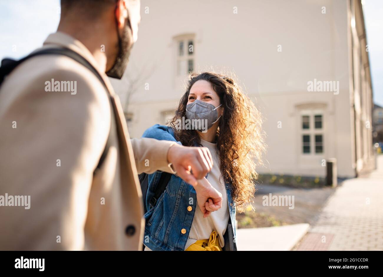 Man woman greeting friends hi-res stock photography and images - Alamy