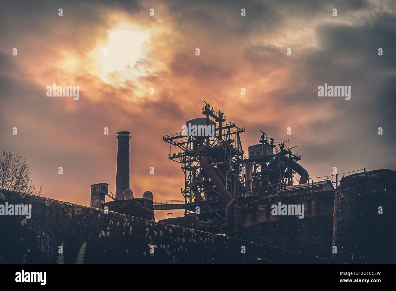 Ironworks in the Ruhr area in dramatic weather. Steelworks, colliery ...