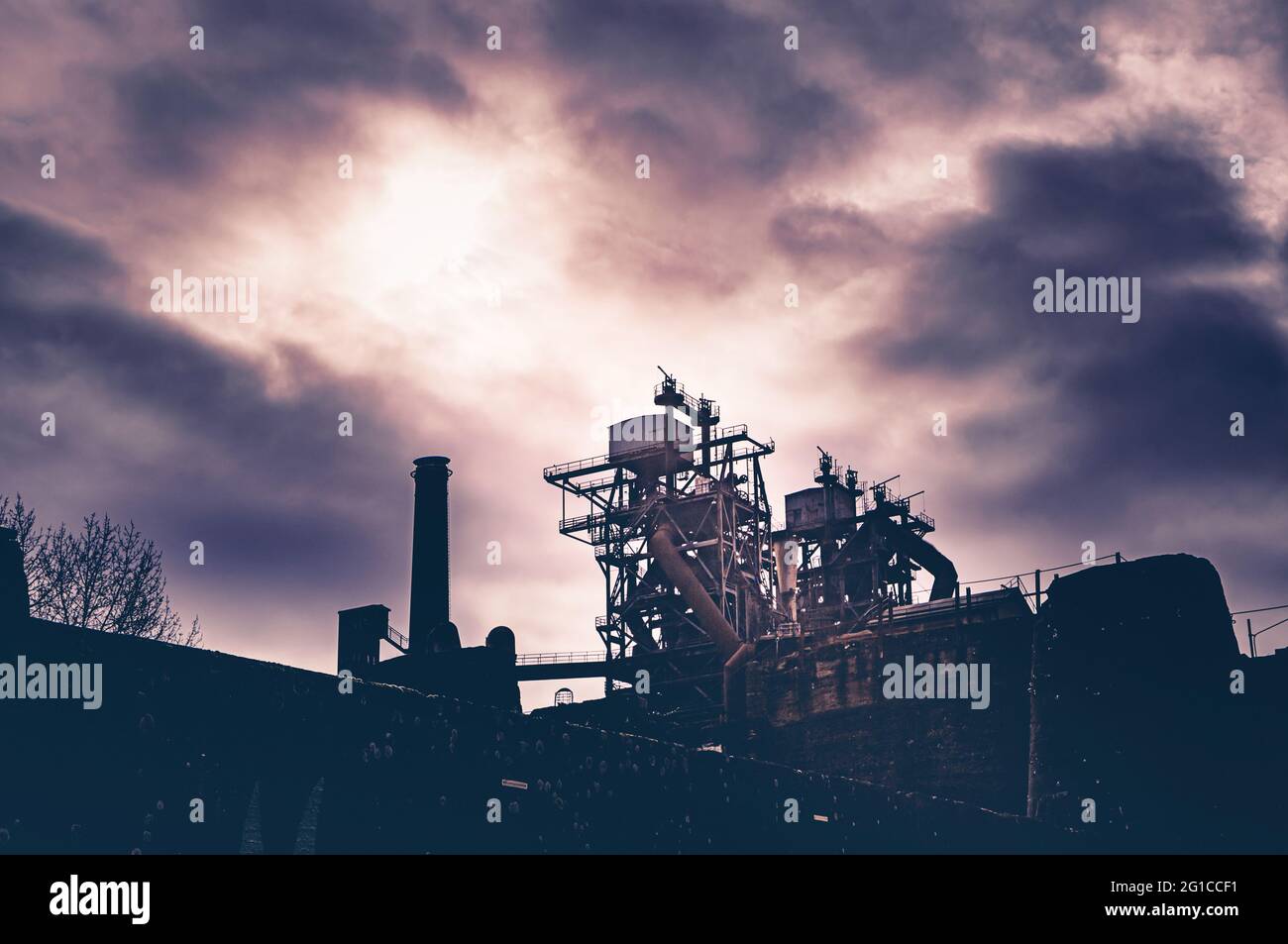 Ironworks in the Ruhr area in dramatic weather. Steelworks, colliery ...