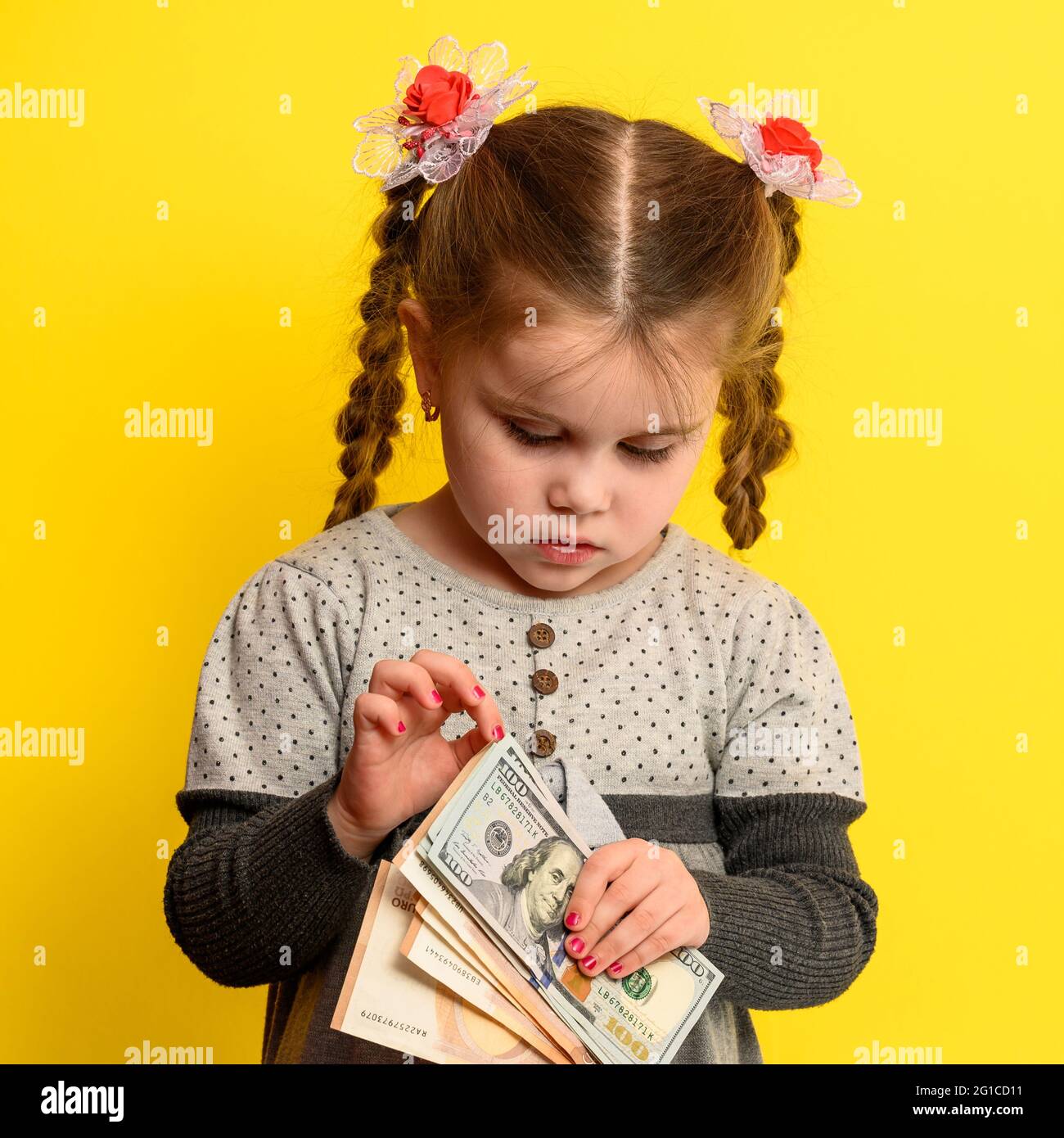 Financial security of the child, the girl holds money in hands, a ...