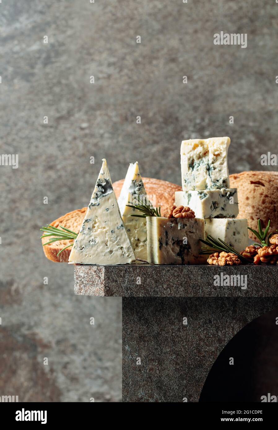 Blue cheese with walnuts, bread, and rosemary. Copy space Stock Photo ...