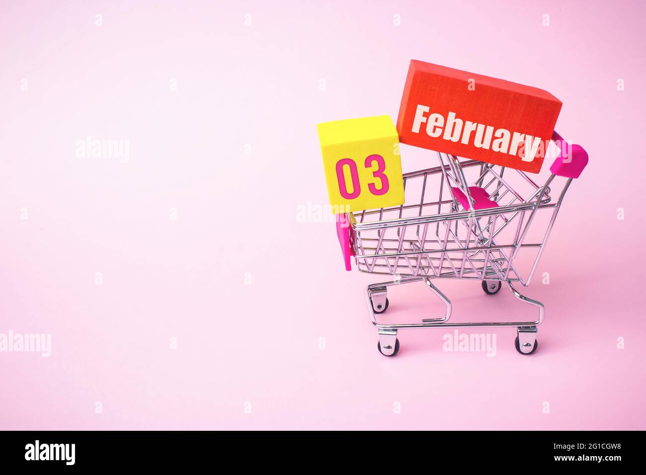 February 3rd. Day 3 of month, Calendar date. Close up toy metal ...