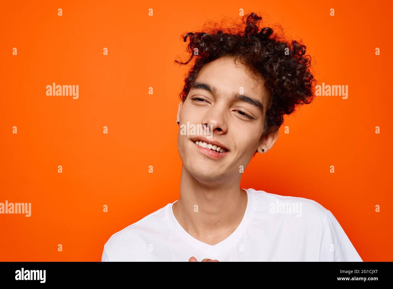 Cheerful man curly hair white t-shirt fashion modern style Stock Photo ...