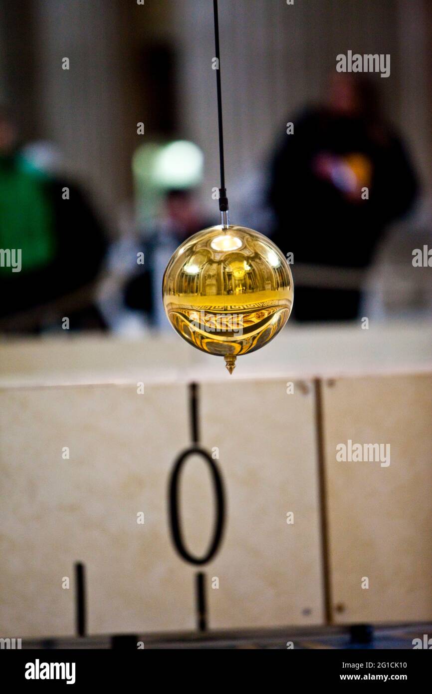 Foucault's pendulum, a 28 kg brass-coated lead weight with a 67 meter ...