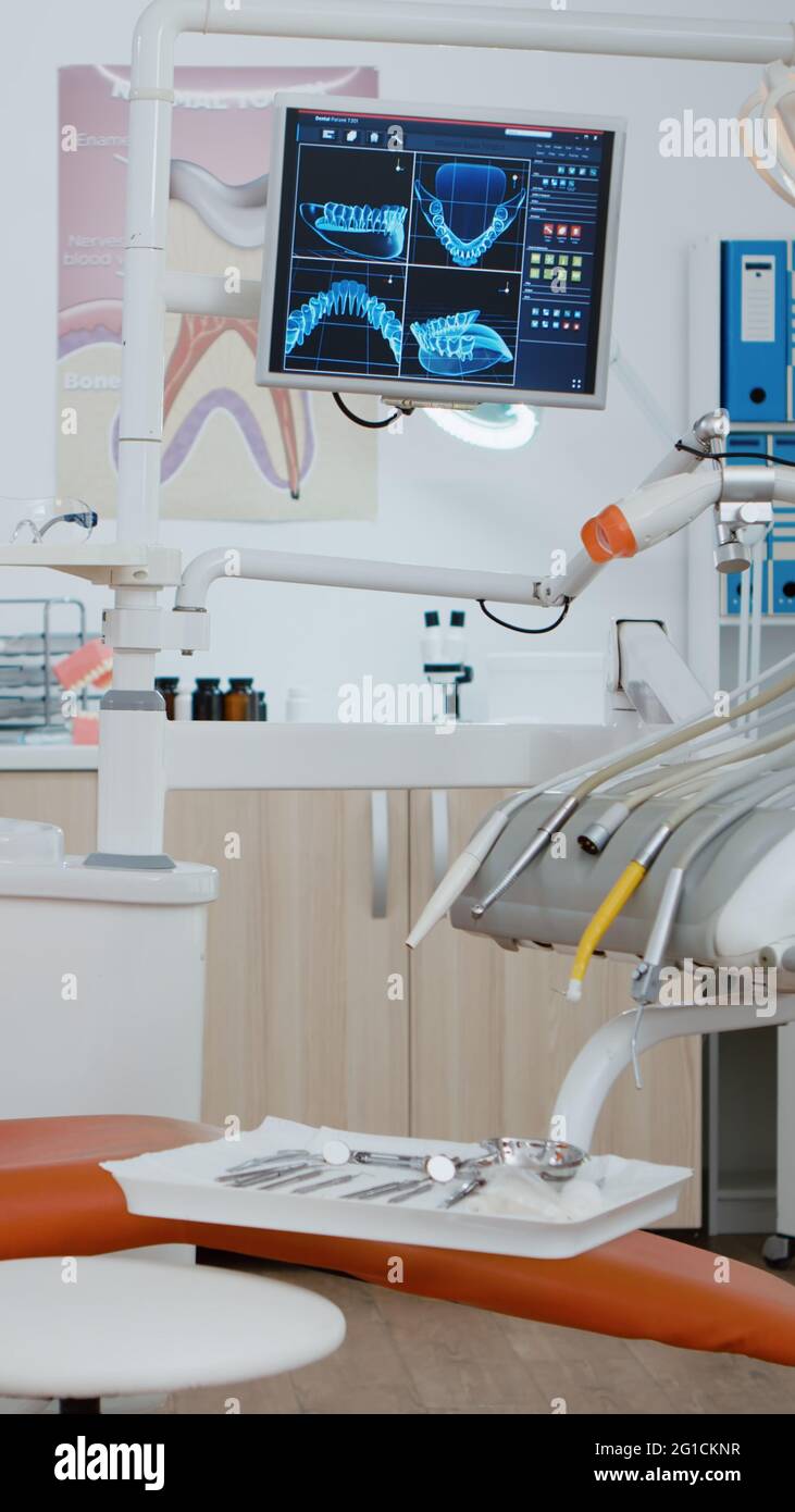 Interior of modern equipped dental office with x ray on monitors ...