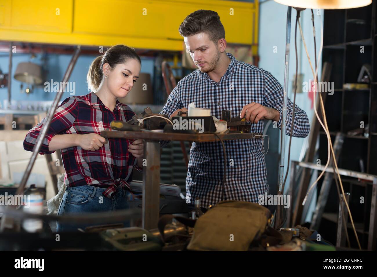Two positive masters are standing with tools Stock Photo - Alamy