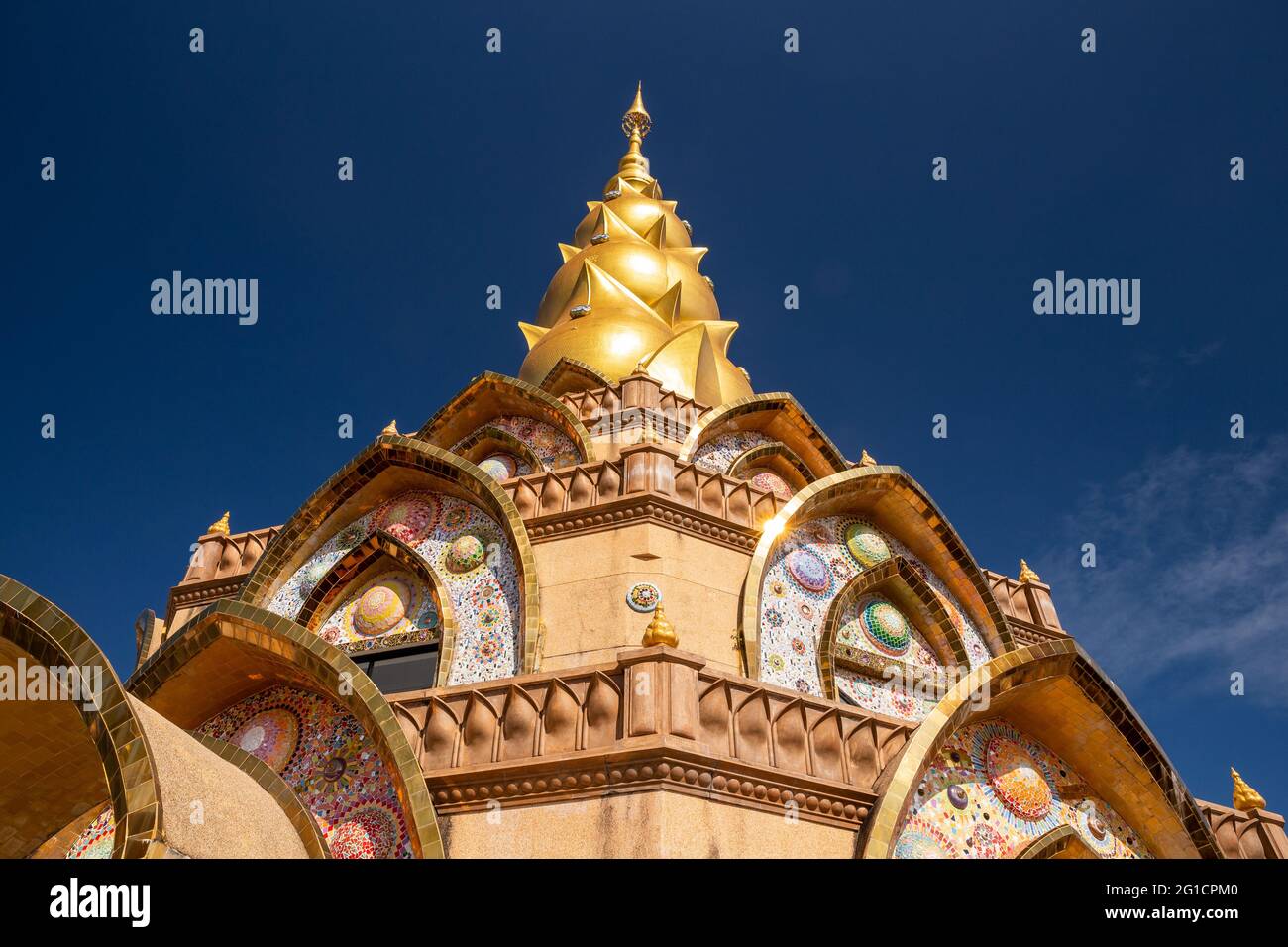 Buddhist tower in pagoda shape with golden peak with blue sky in temple ...