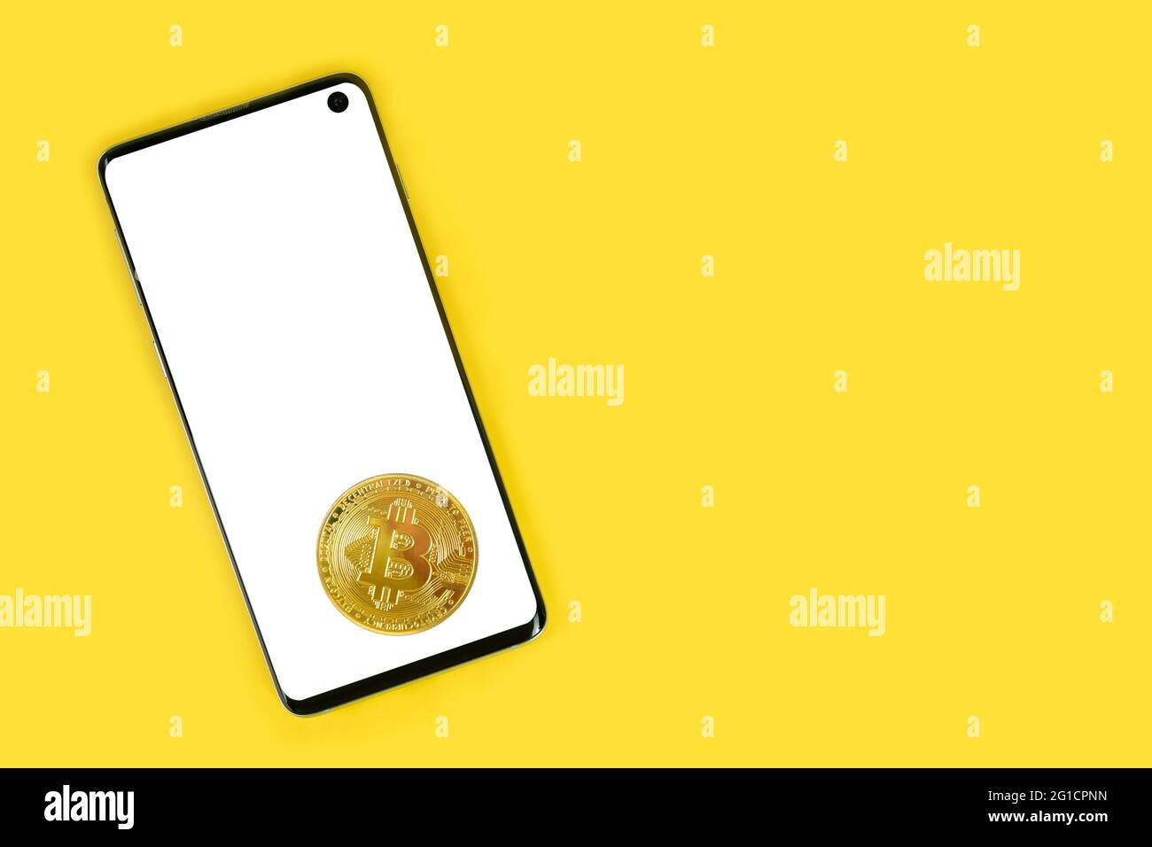 Smartphone with blank white mockup on screen and Bitcoin cryptocurrency ...
