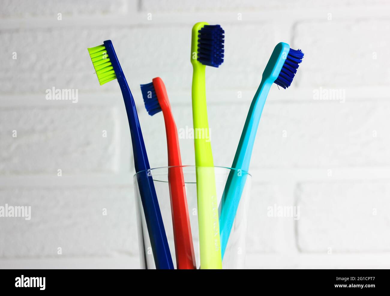 Set of plastic multicolored toothbrushes - green, blue, red, purple ...
