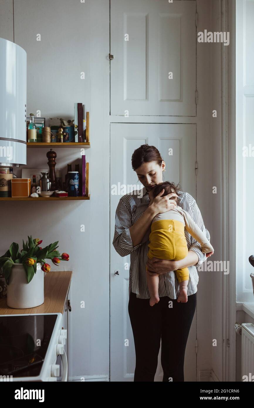 Boy standing mother in hi-res stock photography and images - Alamy