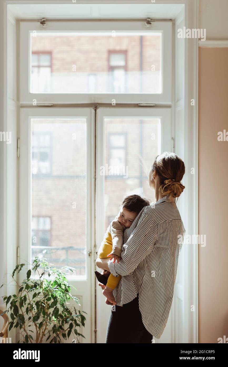 Children through window adult hi-res stock photography and images - Alamy