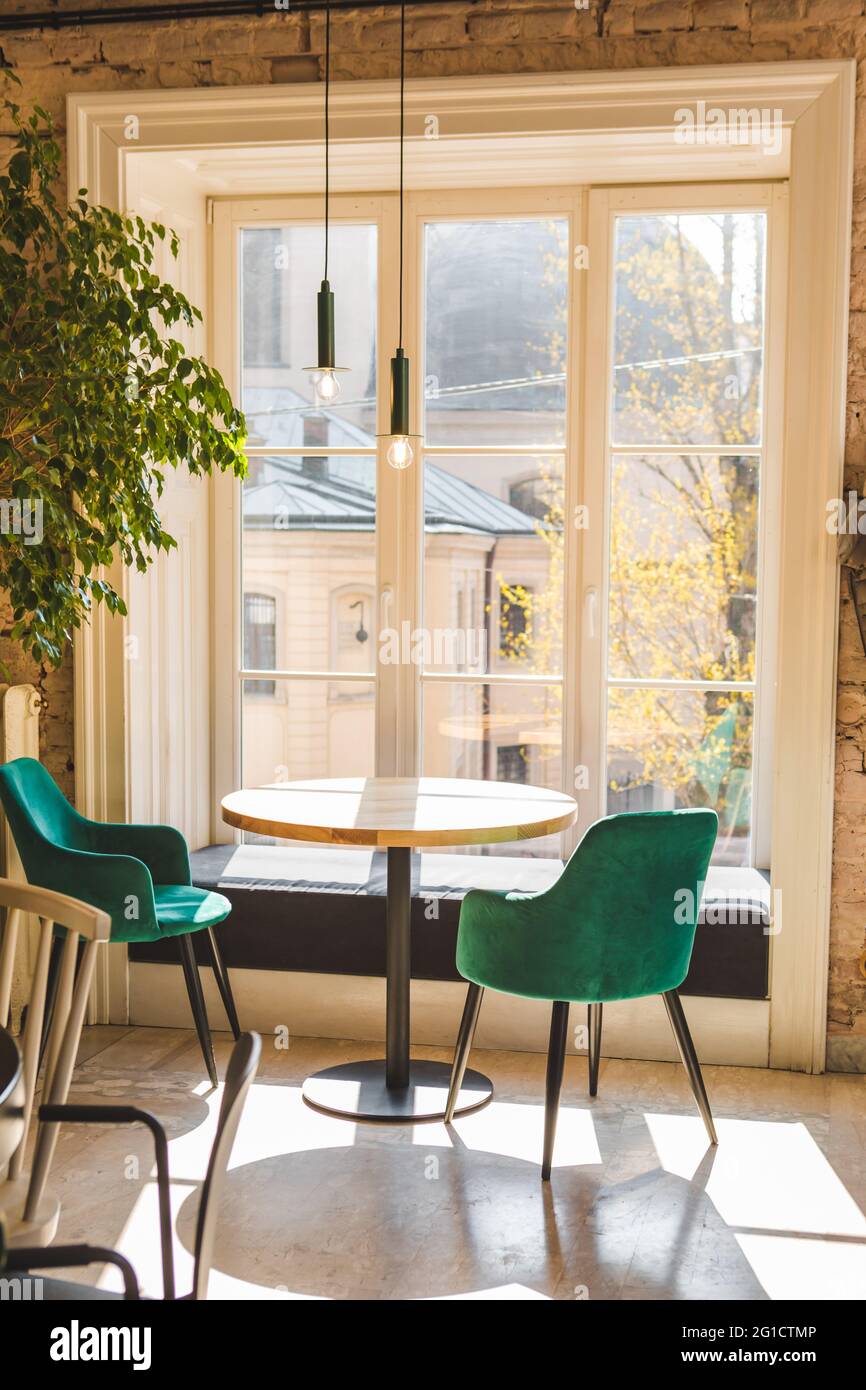 empty table in cafe near window copy space inside interior Stock Photo ...