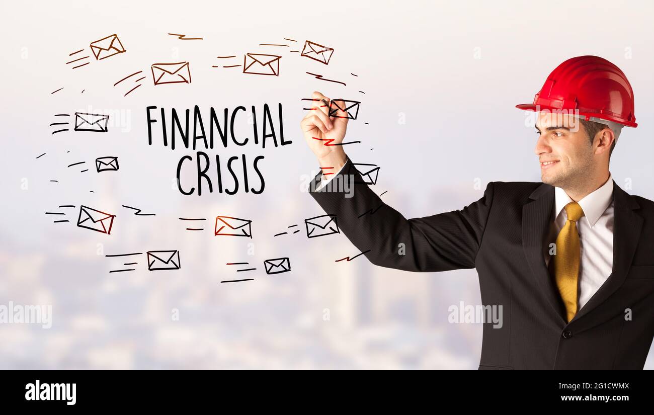Young businessman with helmet drawing sale sign Stock Photo - Alamy