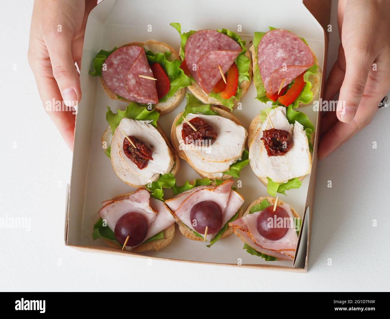 set sandwiches in cardboard packaging in portions in catering services ...