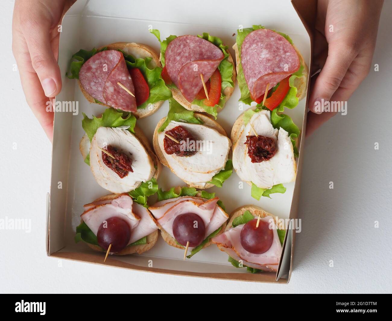 set sandwiches in cardboard packaging in portions in catering services ...