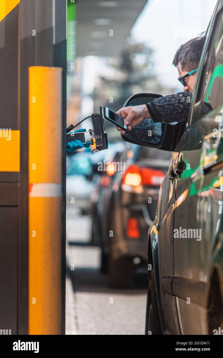 paying for fast food from the car at drive-through close up Stock Photo ...