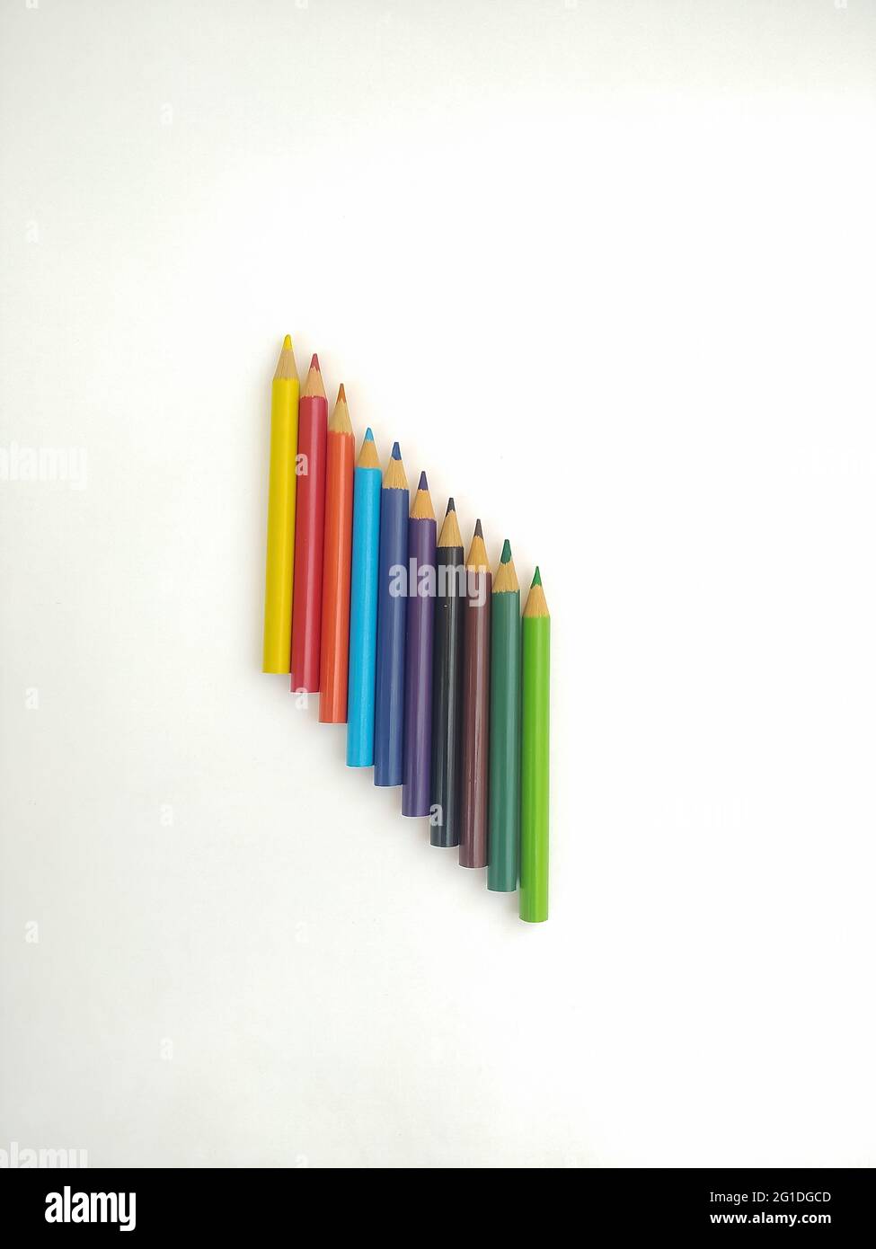 Top view of colored pencils aligned in ladder isolated on white ...