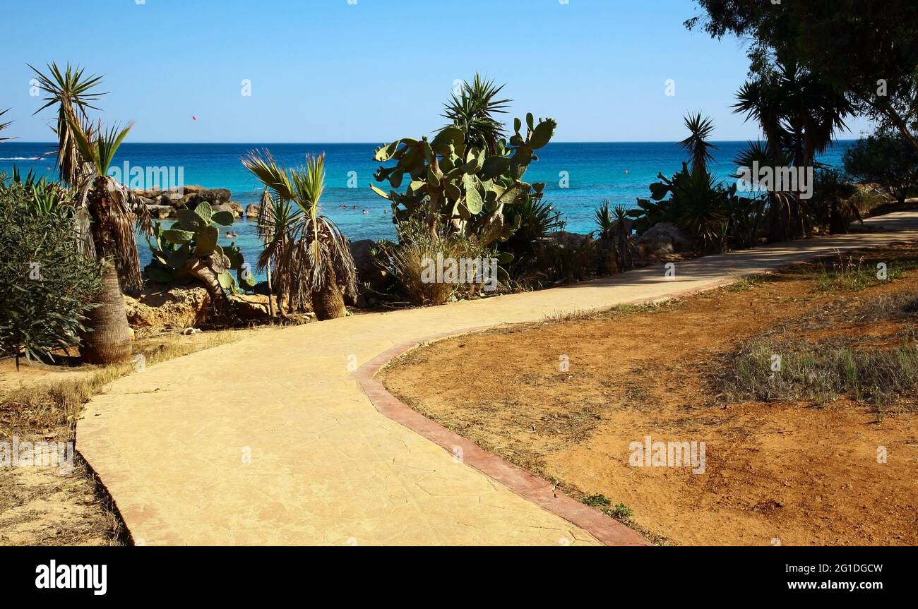 Walking path along the Mediterranean Sea near the Adams Beach Hotel in ...