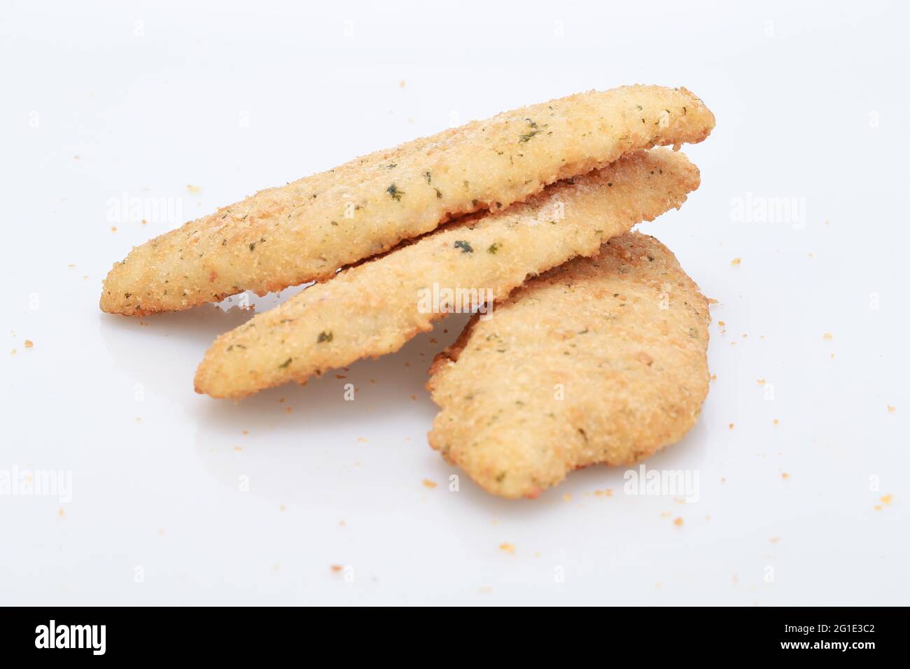 Closeup shot of frozen fish cream dori with breading on white ...