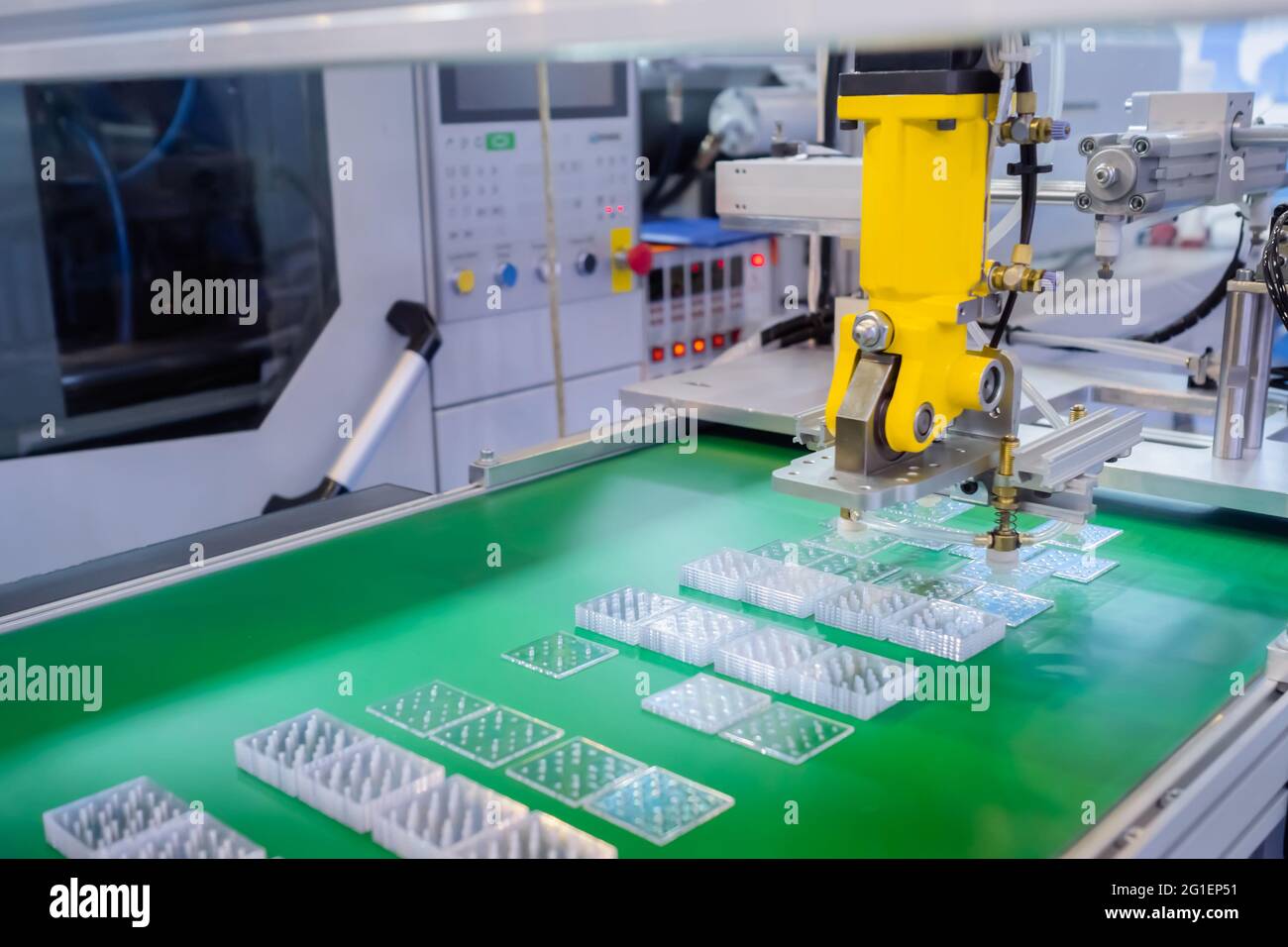 Pick and place robotic arm manipulator moving plastic detail on ...