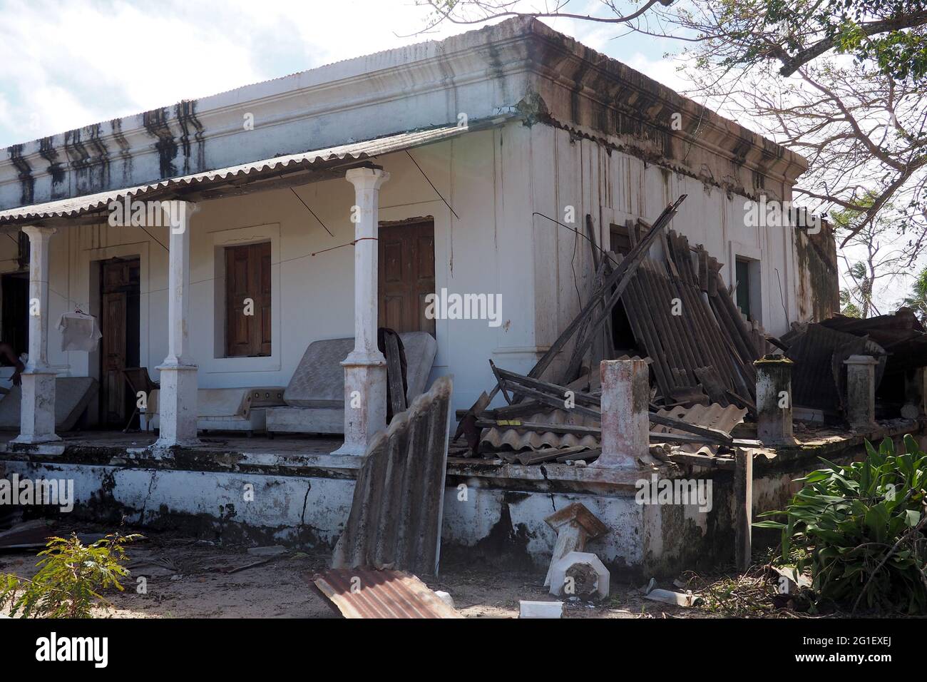 Damaged houses and roads after a cyclone in small african town of Pemba ...