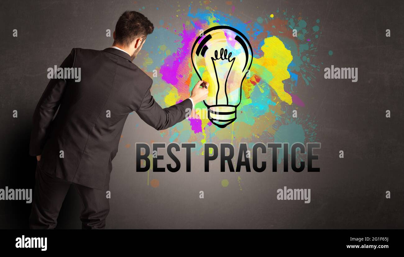 businessman drawing colorful light bulb Stock Photo - Alamy