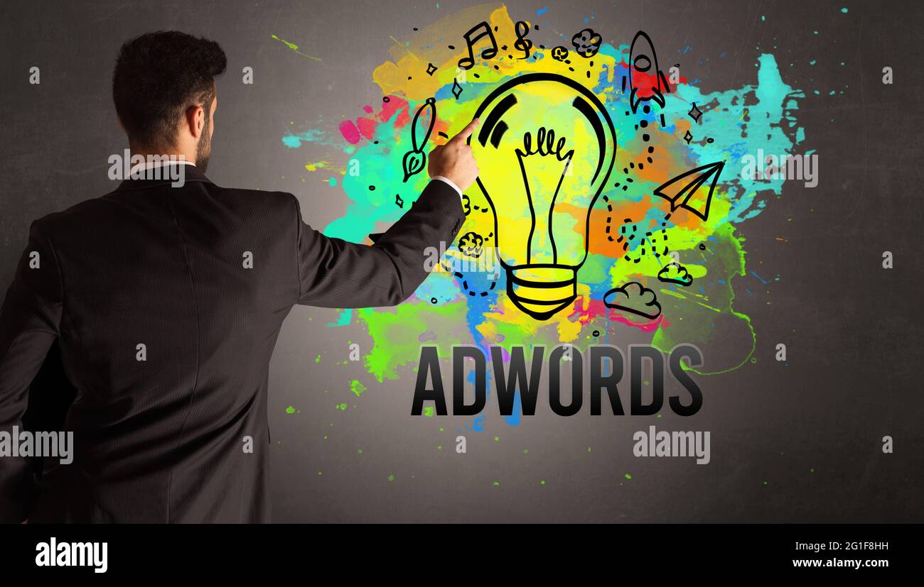 businessman drawing colorful light bulb Stock Photo - Alamy