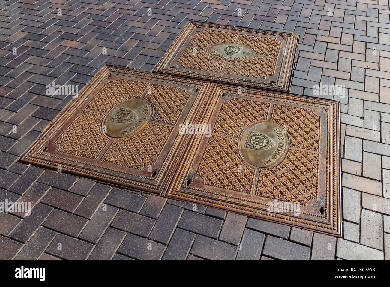 Iron square manhole covers in Varkerulet, Sopron, Hungary Stock Photo ...