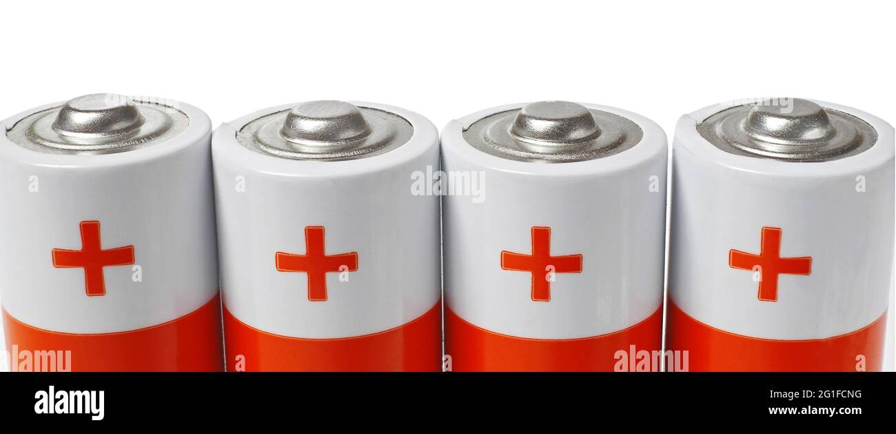 macro of positive terminals of four aa dry cell batteries isolated on ...