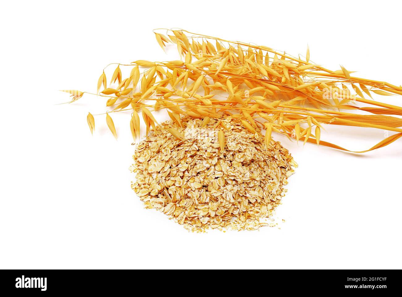 ripe oat ears and pile of oat rolled cereals isolated on white ...