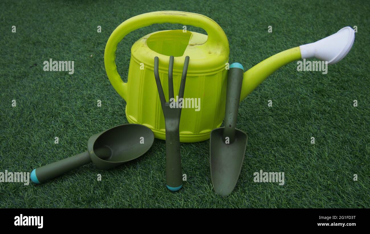 Closeup shot of plastic garden tools in the grass Stock Photo - Alamy