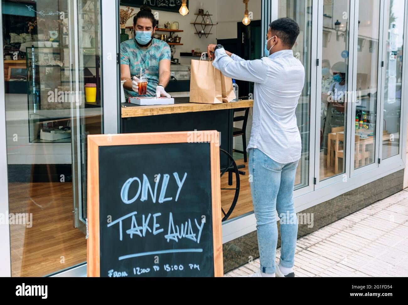 Man picking up take away food order Stock Photo - Alamy