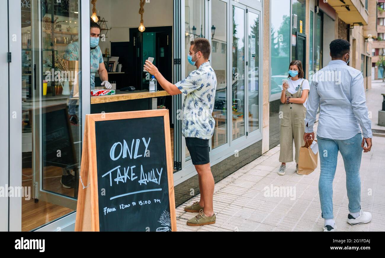 Man picking up take away food order Stock Photo - Alamy