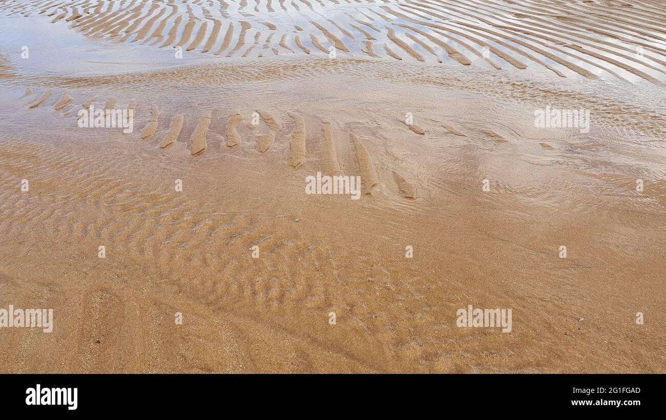 Patterns in sand, shaped by sea Stock Photo - Alamy