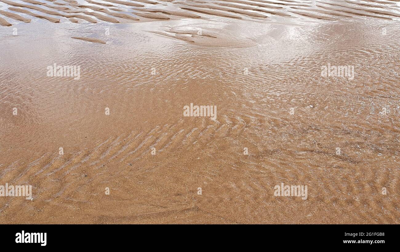 Patterns in sand, shaped by sea Stock Photo - Alamy