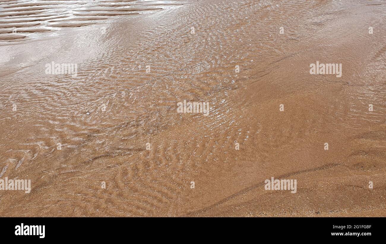 Patterns in sand, shaped by sea Stock Photo - Alamy