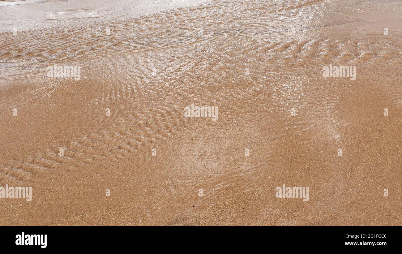 Patterns in sand, shaped by sea Stock Photo - Alamy