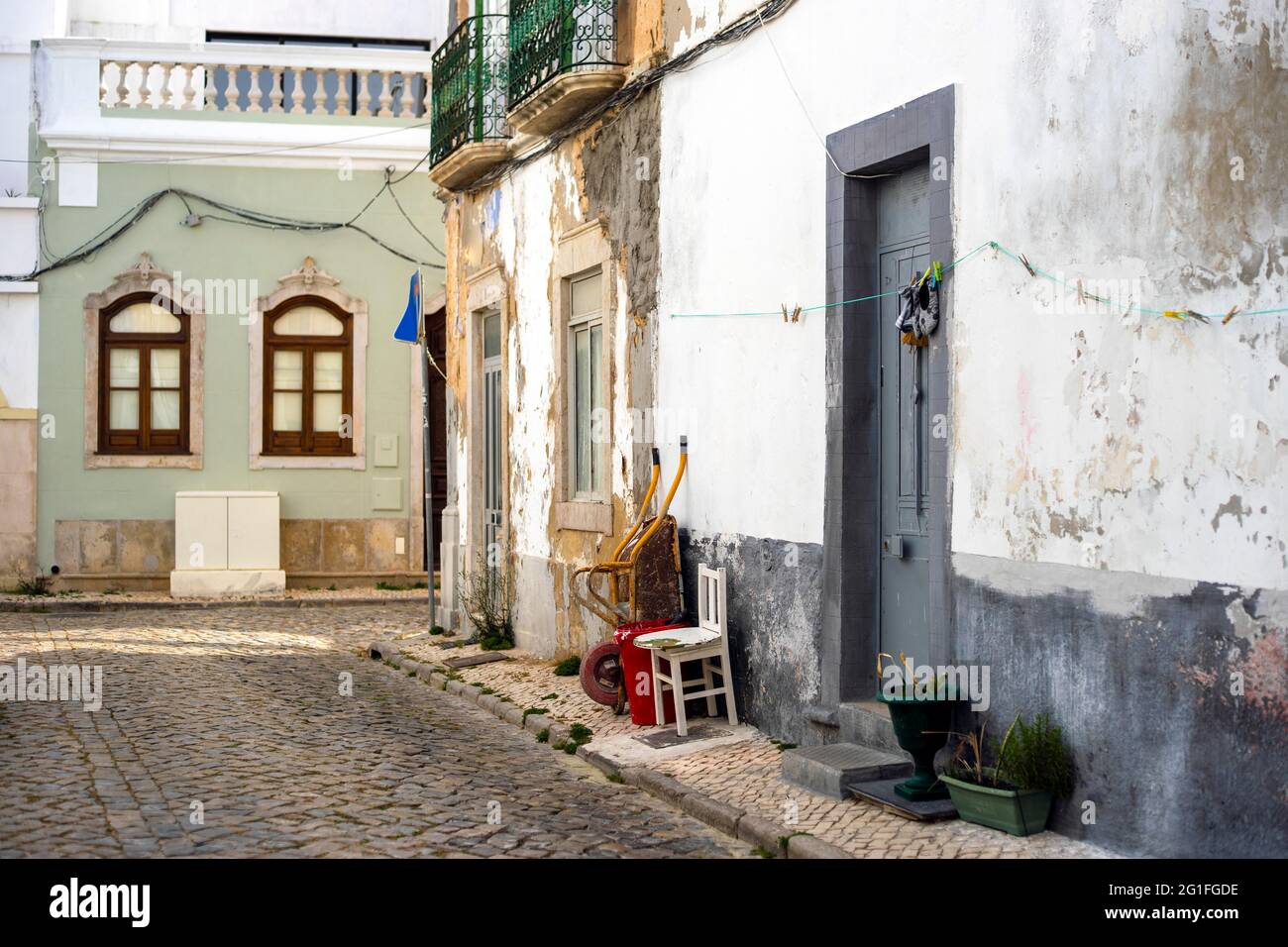 Narrow street of historic fishermen's town called Olhao, Algarve ...