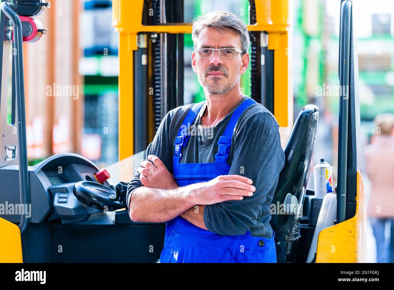 Hardware store employee in warehouse for home improvement equipment ...