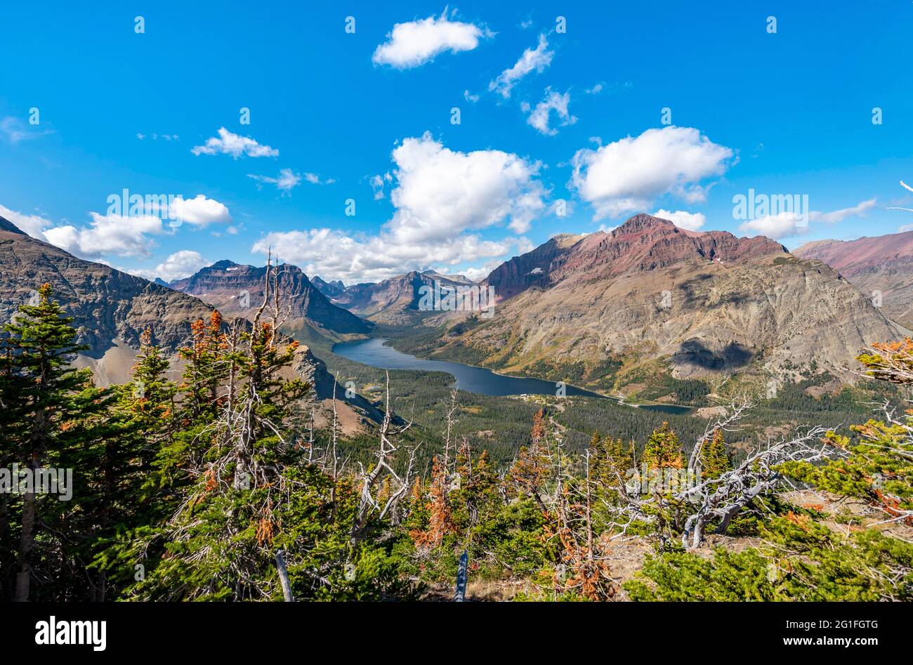 View of Two Medicine Lake with forest, hiking trail to Scenic Point ...