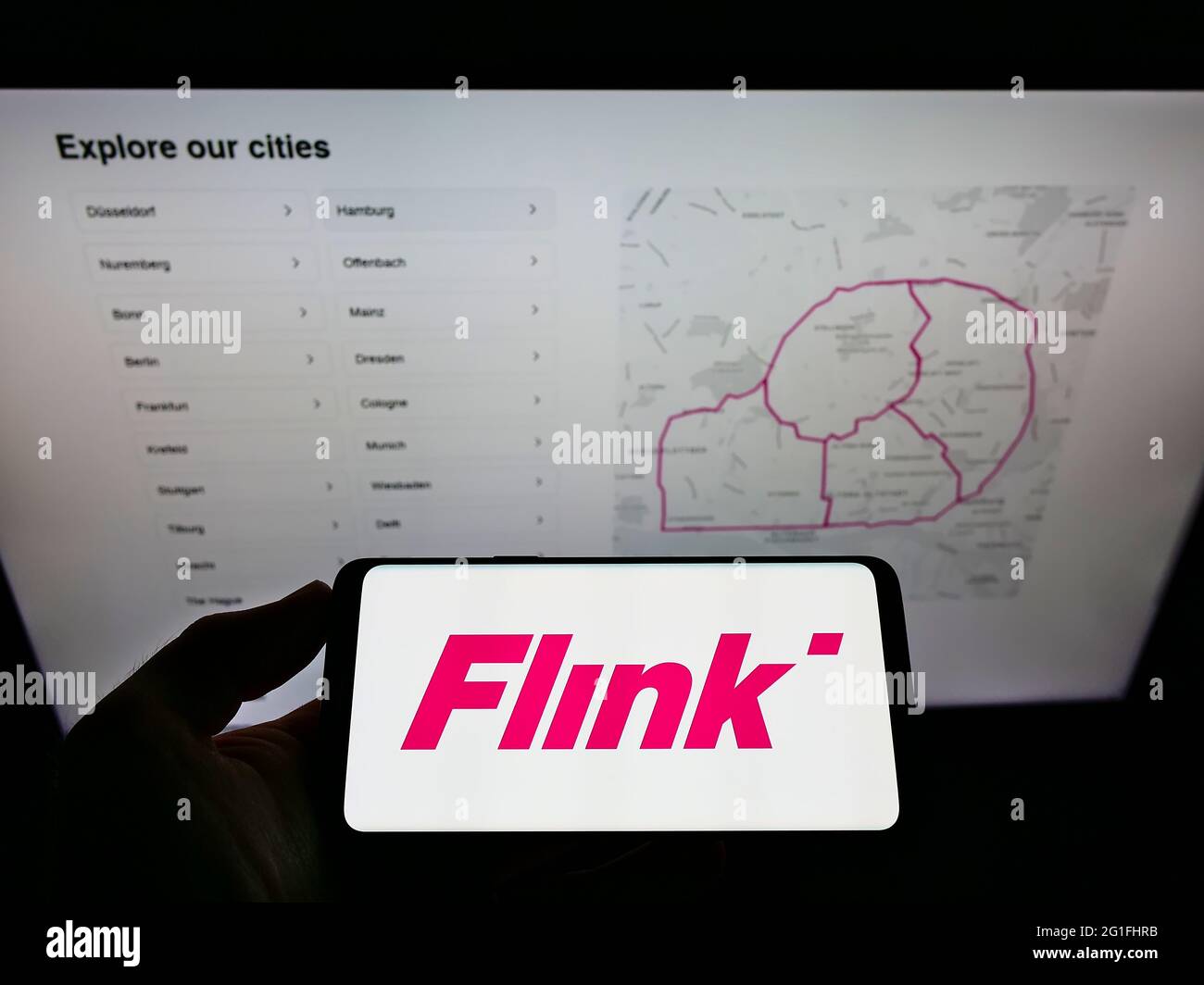 Person holding cellphone with logo of German grocery delivery company ...