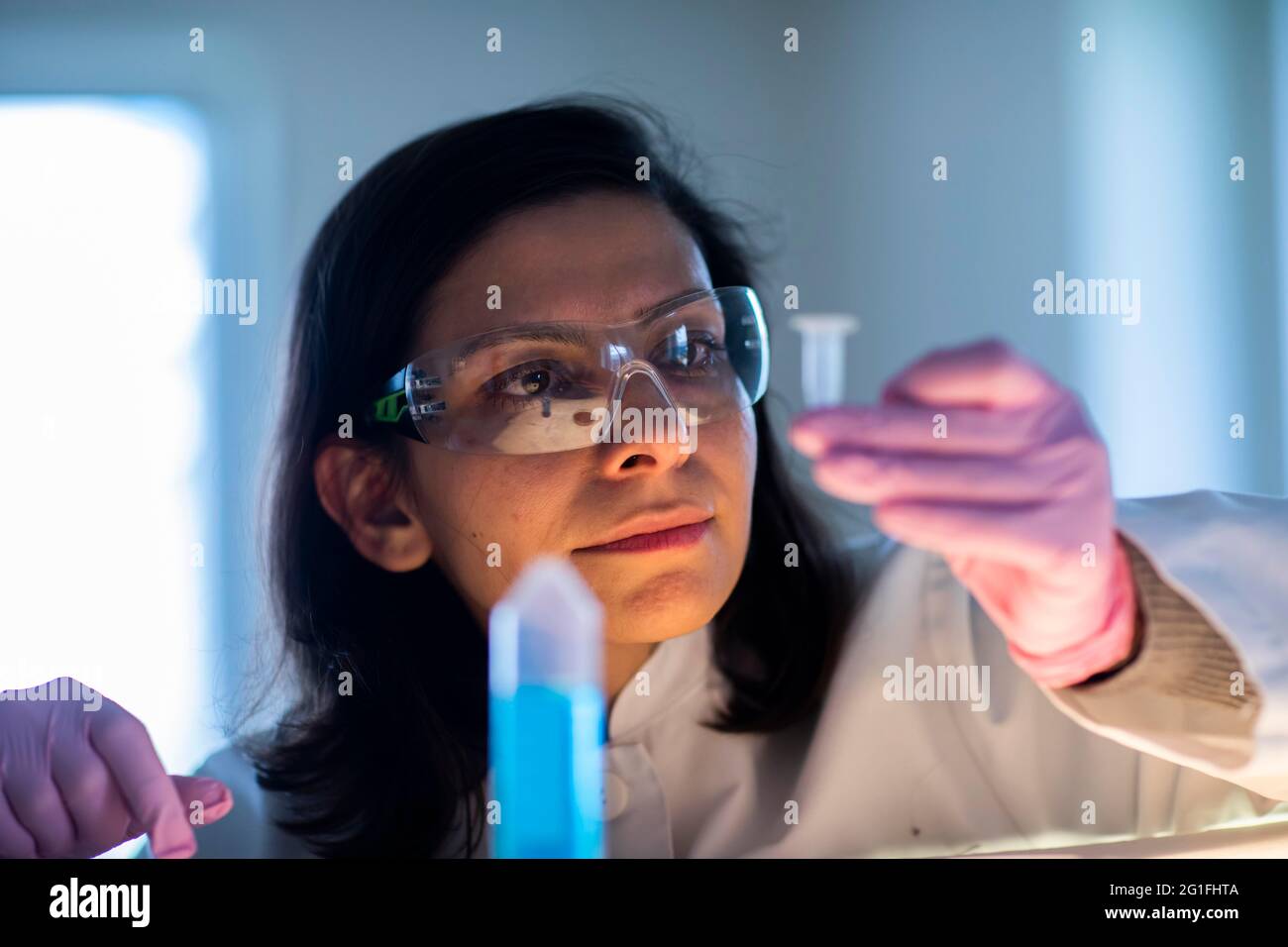 Middle aged technician in laboratory with lab coat, Freiburg, Baden ...