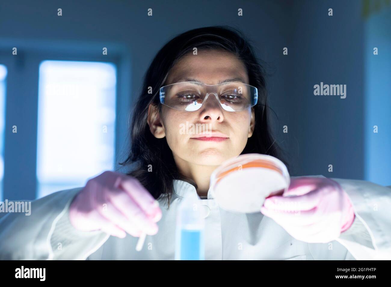 Middle aged technician in laboratory with lab coat, Freiburg, Baden ...